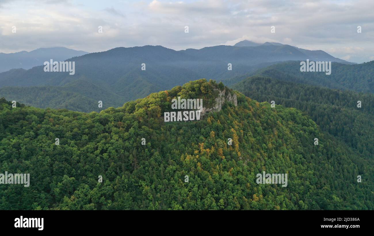 Drone top aerial view of Brasov town sign in Transylvania, Romania with ...