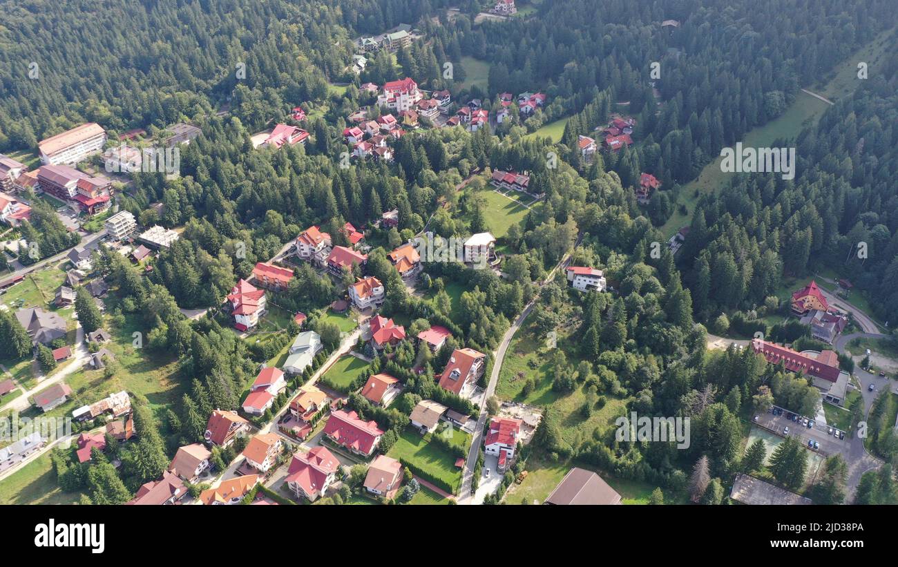 Aerial drone top view of Transylvania town and forests, hills and ...