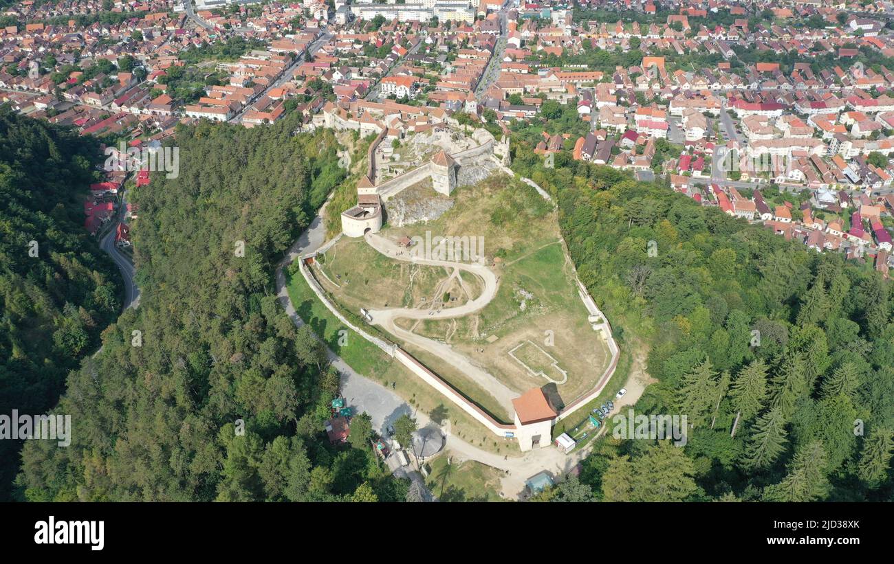 Aerial drone top view of Transylvania town and forests, hills and ...