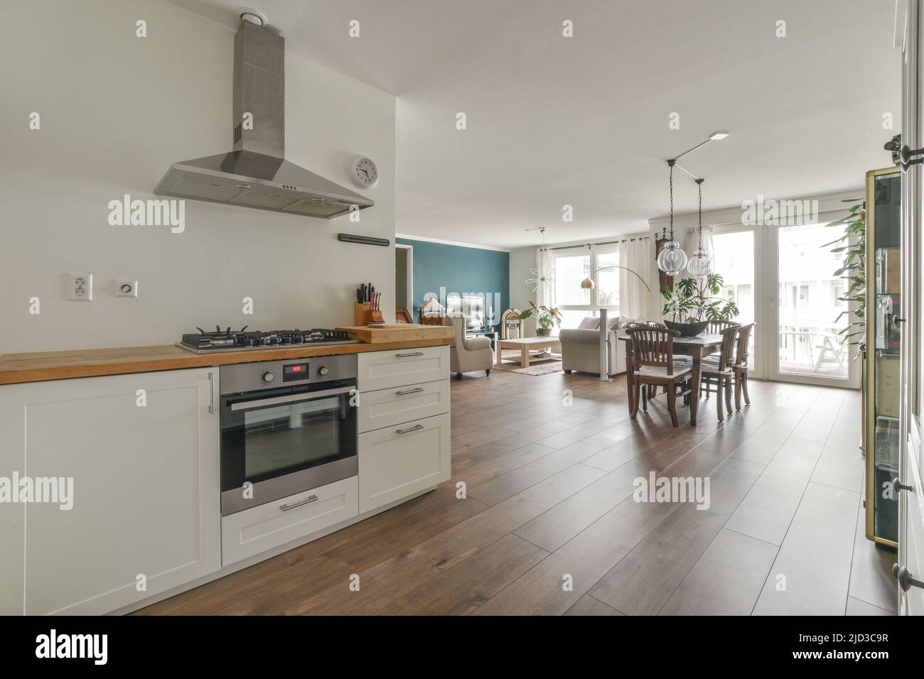Spacious bright kitchen with dining area, modern design and panoramic windows Stock Photo - Alamy