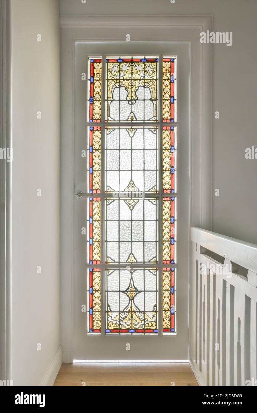 Spacious bright stained glass window with beautiful painted patterns ...