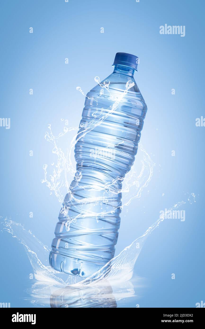 Water splash of bottle isolated on blue background. Vertical format ...