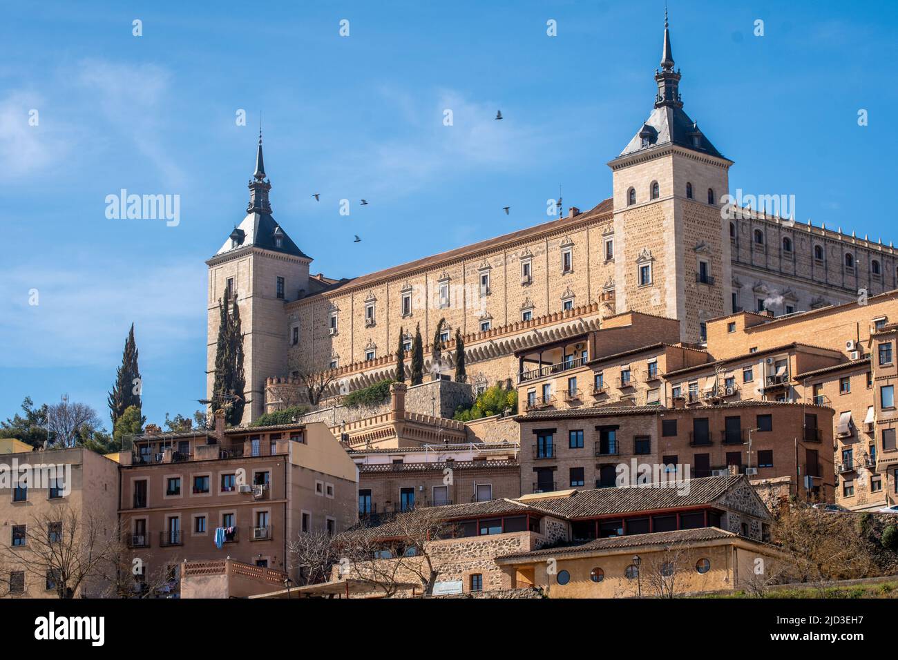 Alcazar of Toledo towering over the city in Toledo, Spain Stock Photo ...