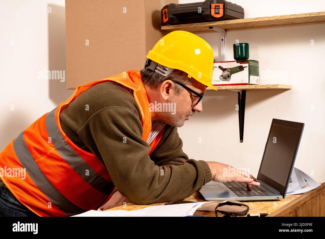 Caucasic Engineer checking laptop in work office. Concept of work ...
