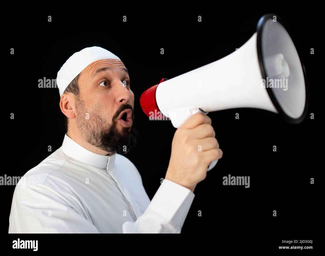 Handsome man with beard shouting through megaphone for Hajj in Mekkah ...