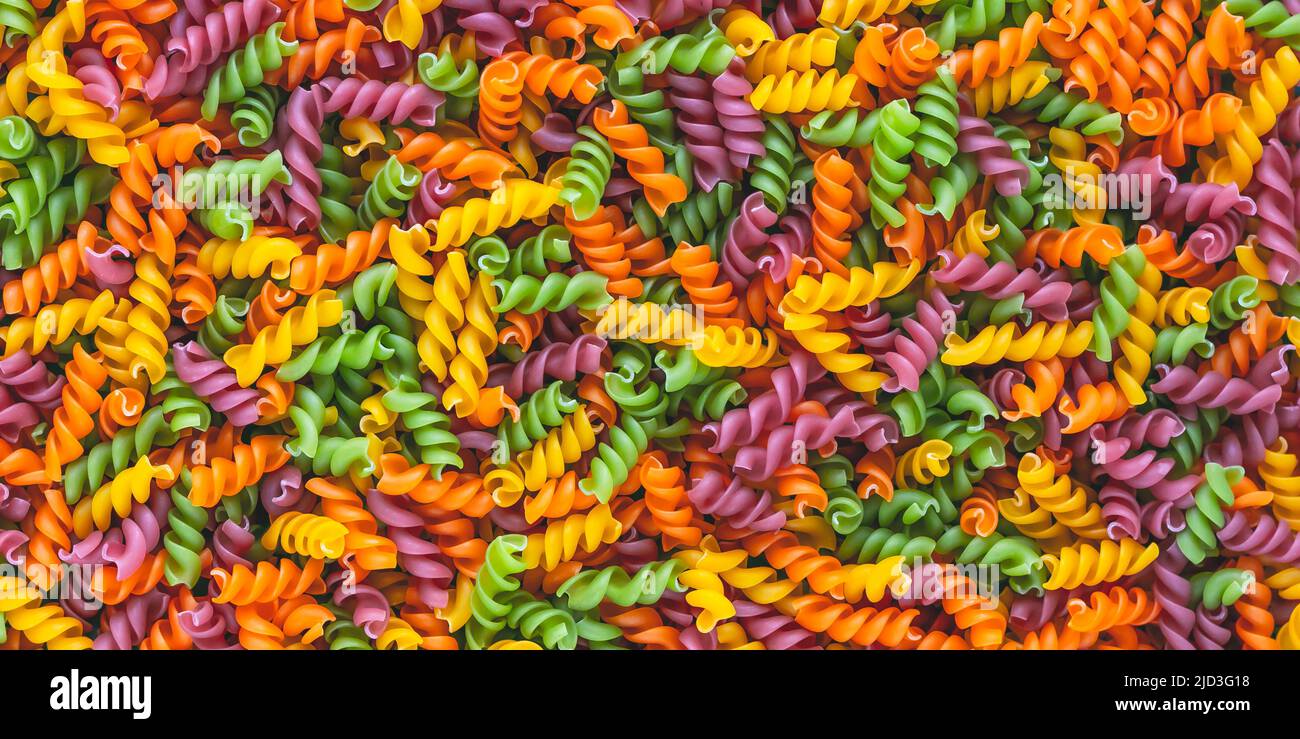 Italian pasta pattern, colorful background. Various colors of fusilli ...