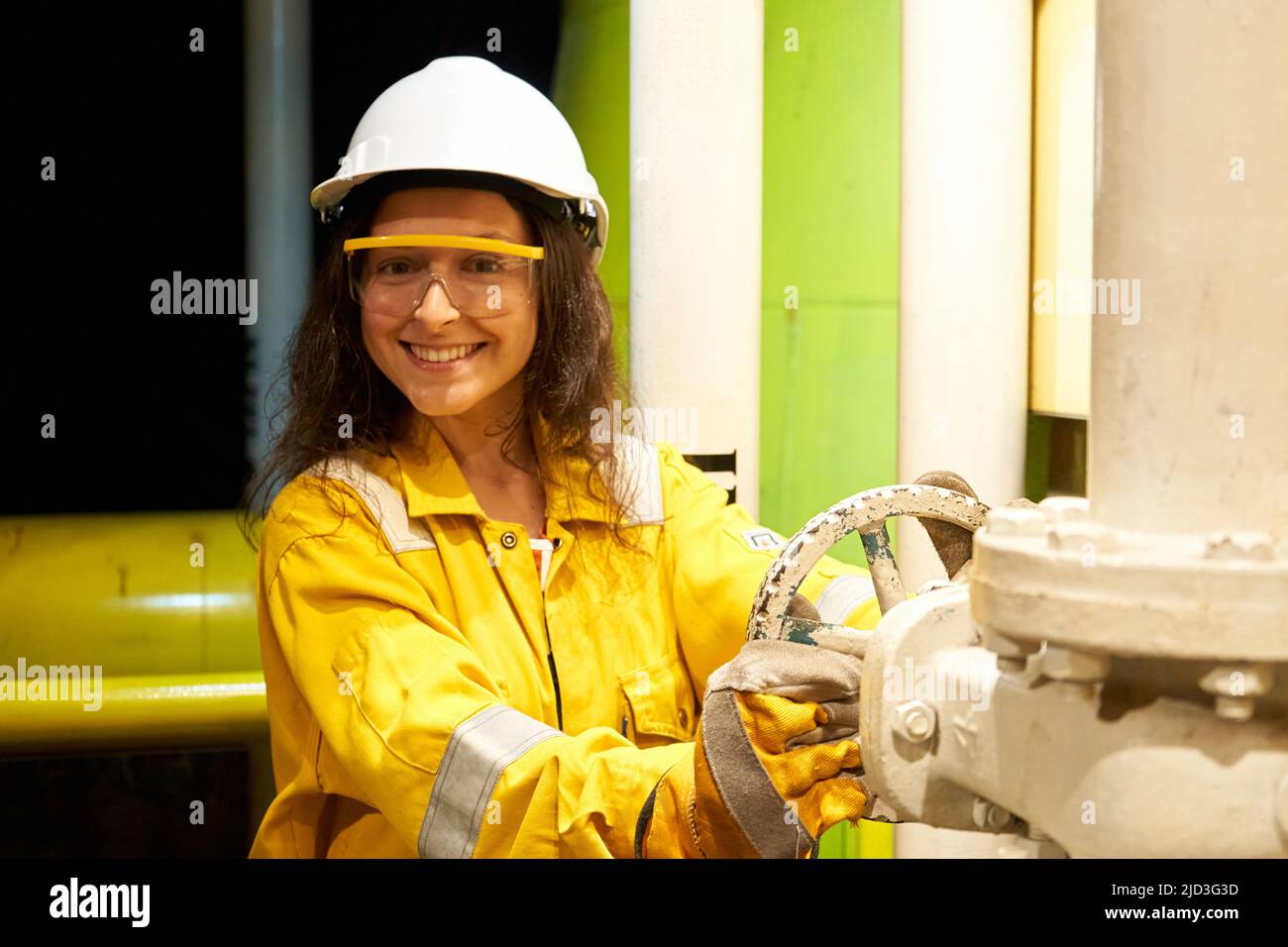 Installation showing the process of drilling an oil well. Woman in ...