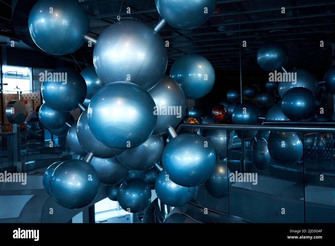 Installation of stylish connected silver balls decoration modern ...