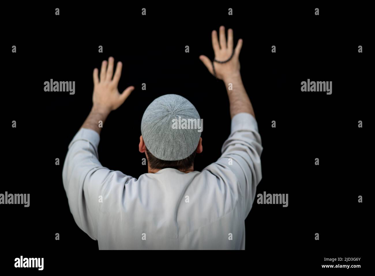 Muslim man standing and praying in the front of Kaaba in Mecca, KSA ...