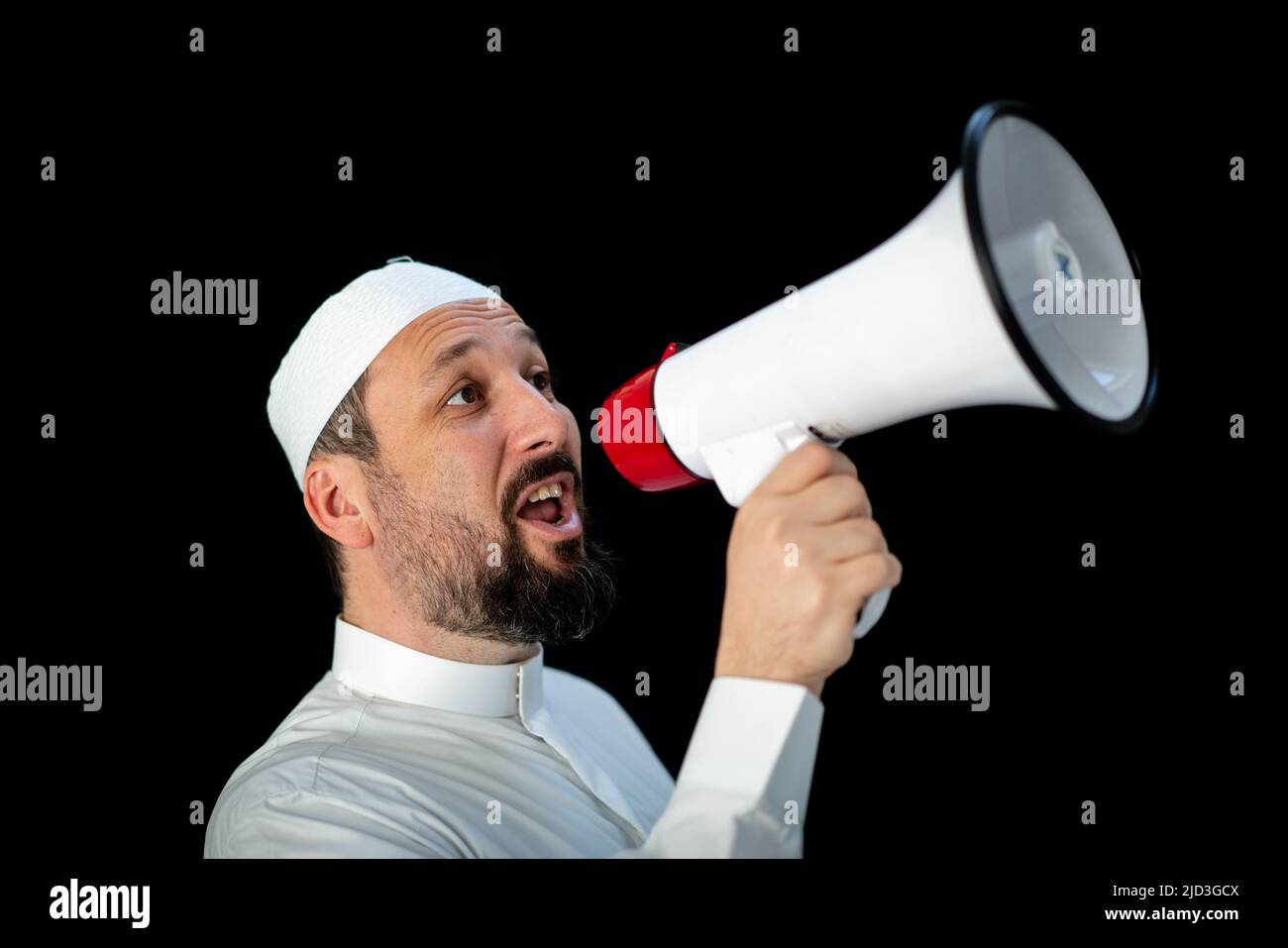 Handsome man with beard shouting through megaphone for Hajj in Mekkah ...