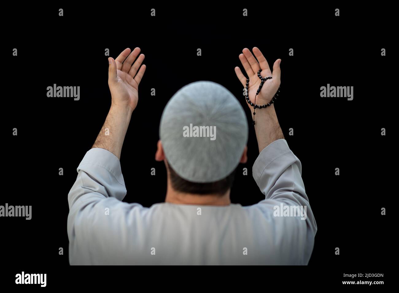 Muslim man standing and praying in the front of Kaaba in Mecca, KSA ...