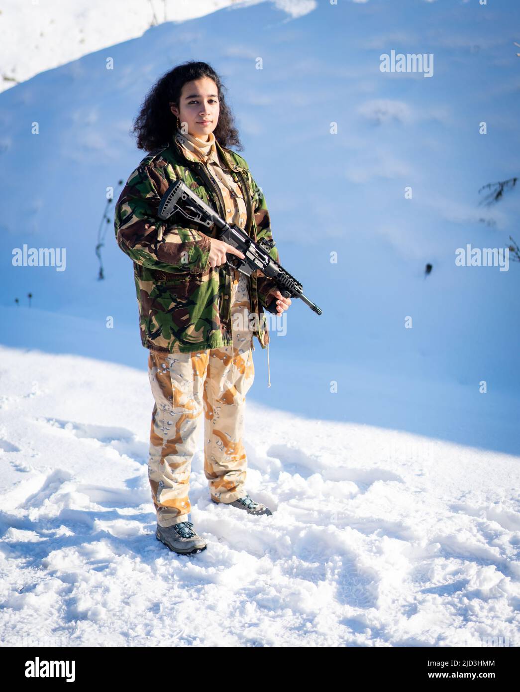 Young Female Soldier In Military Uniform On Winter Snow. High quality ...