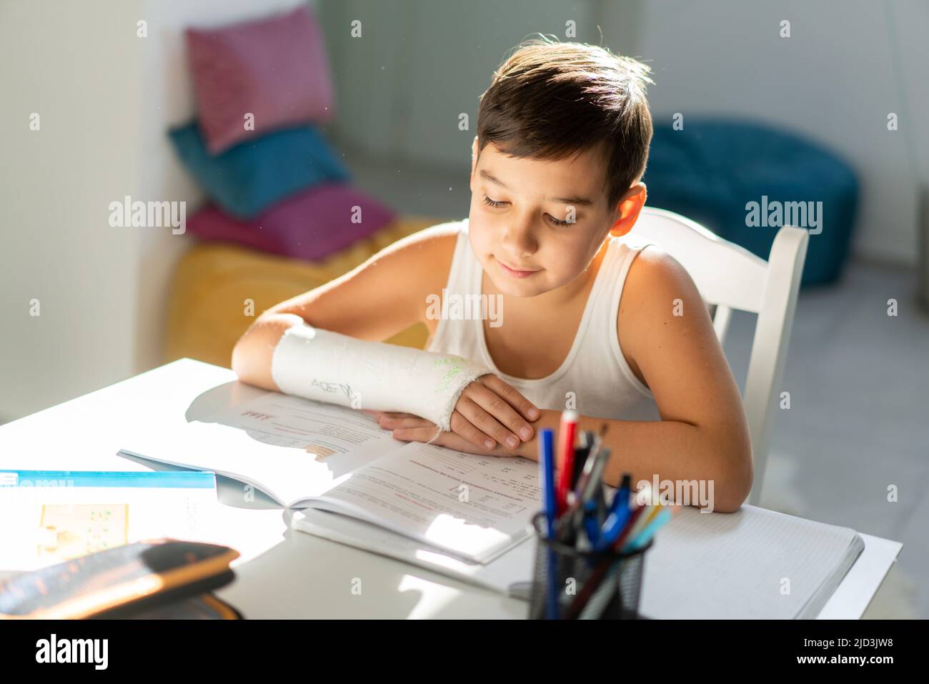 Happy pre teen boy studying hi-res stock photography and images - Alamy