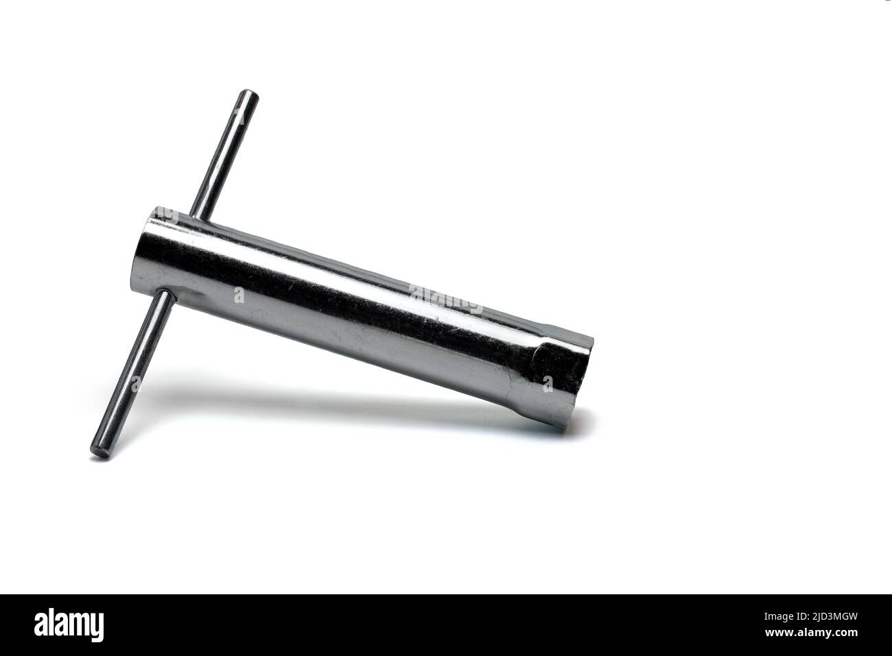 Close up of silver metal tool with handle pushed through and hexagonal ...