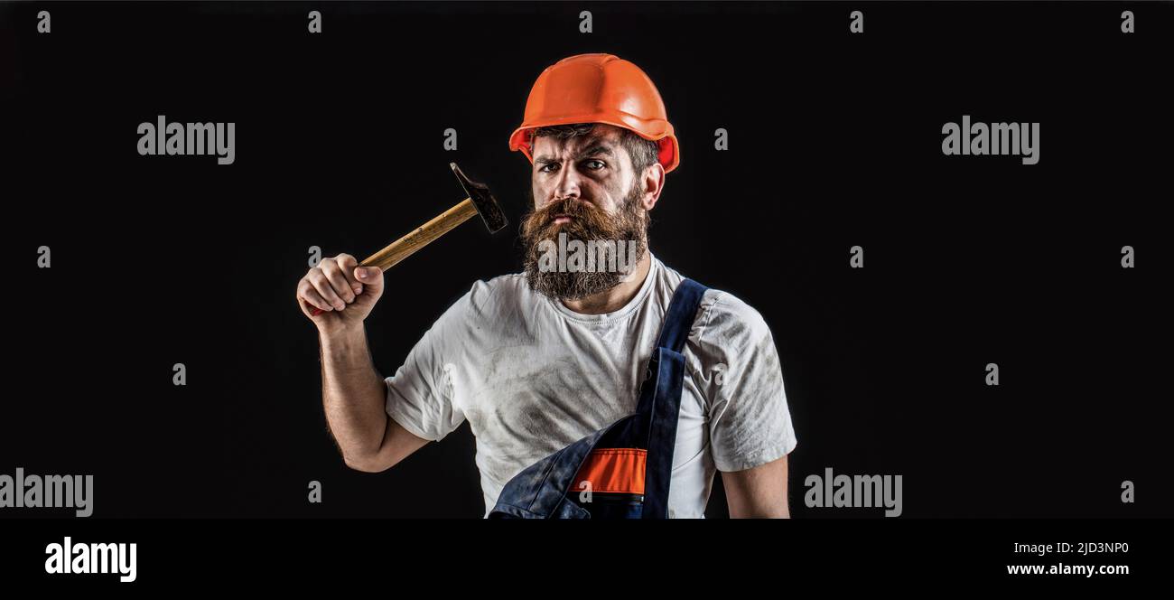 Bearded man worker with beard, building helmet, hard hat. Hammer ...