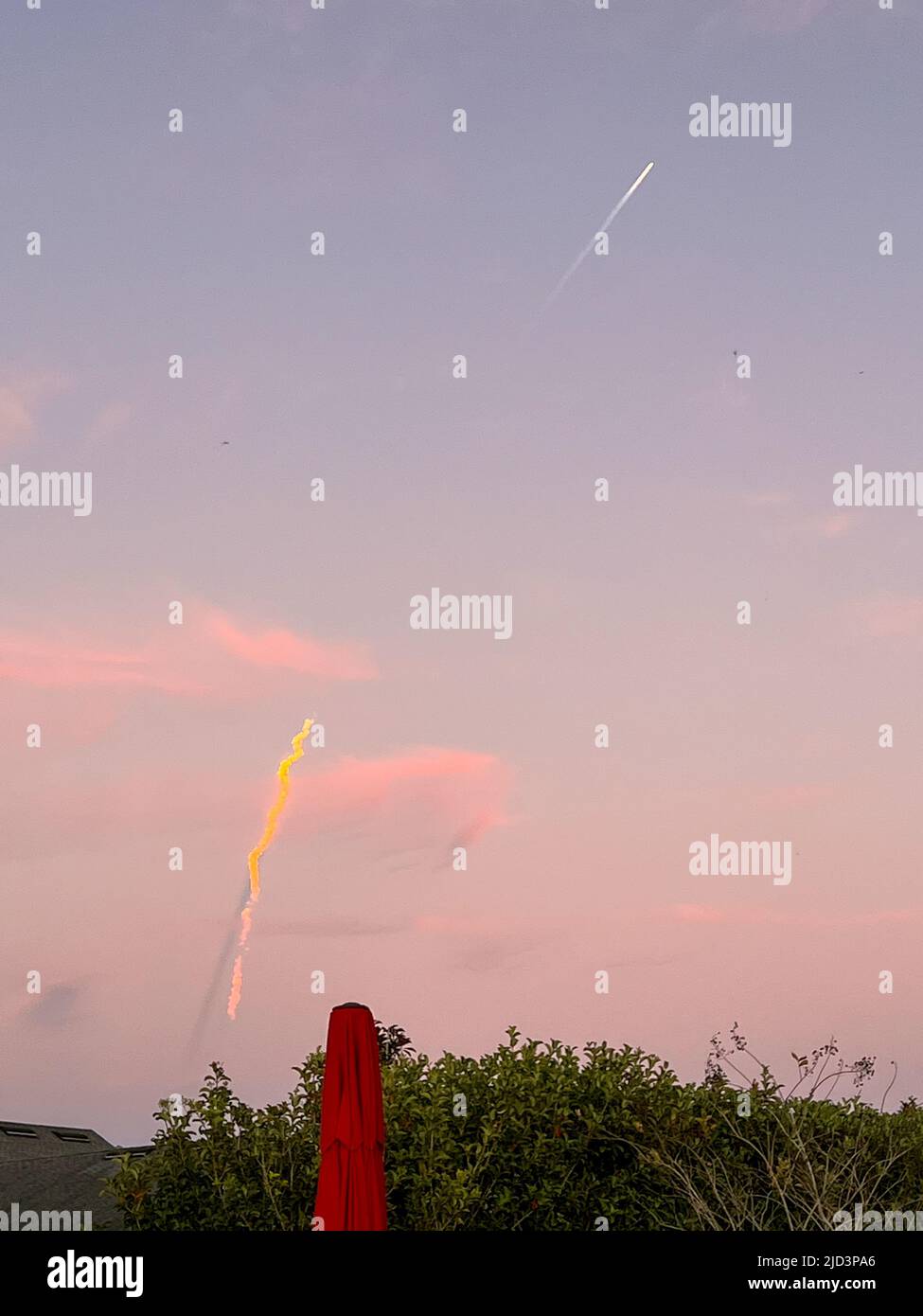 Exhaust trail from a rocket launchon a beautiful evening in Florida ...
