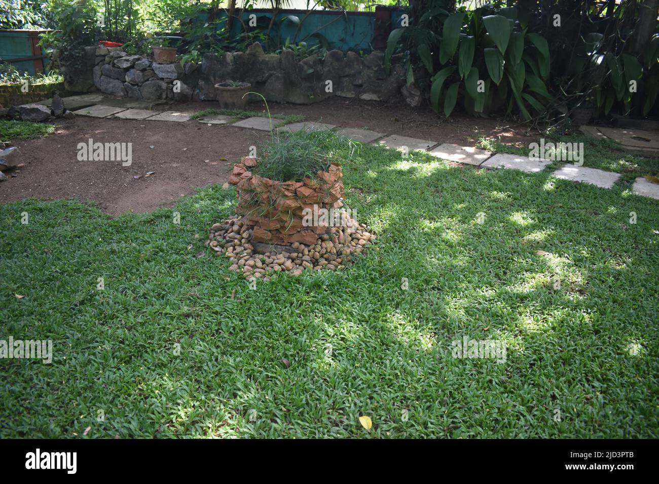 A landscaped garden with herbal trees, flowers, fruit trees, ponds ...