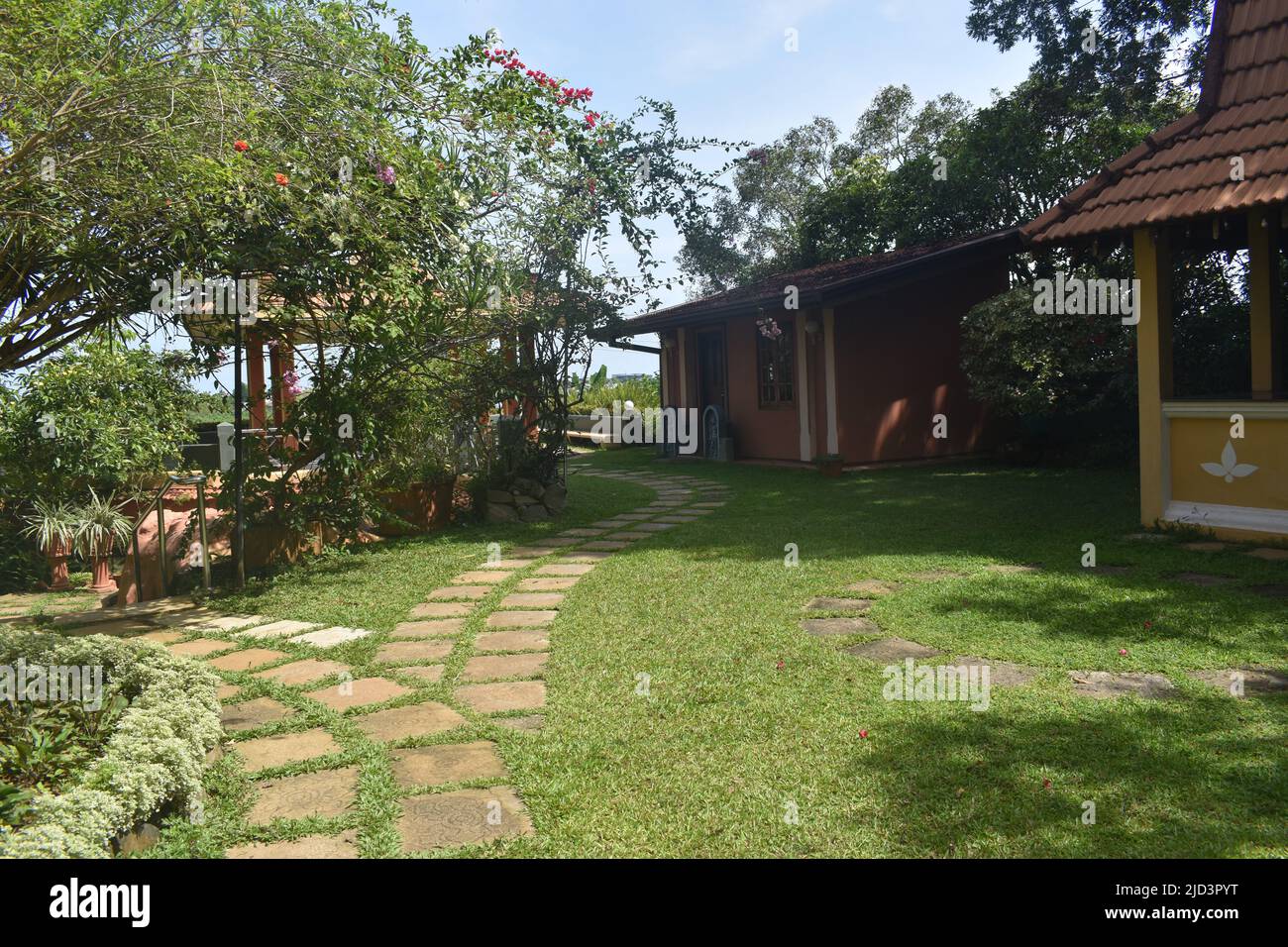 A landscaped garden with herbal trees, flowers, fruit trees, ponds ...