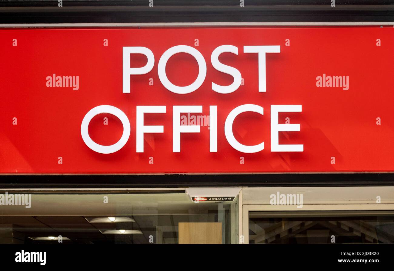 Red and white post office sign in the UK Stock Photo - Alamy