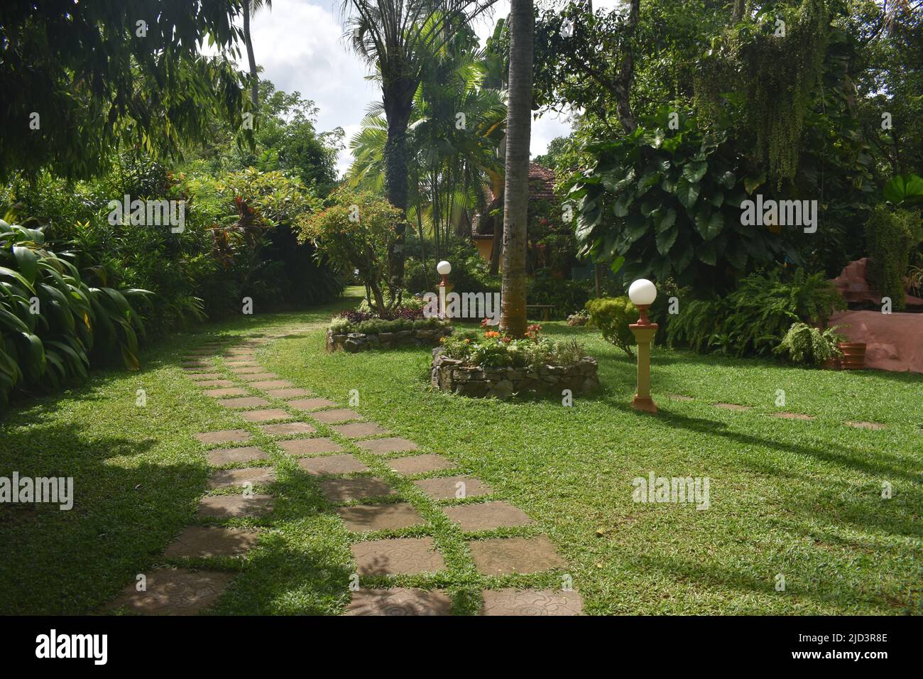 A landscaped garden with herbal trees, flowers, fruit trees, ponds ...