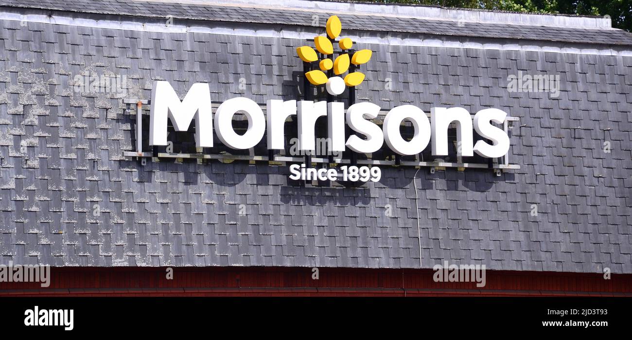 Exterior sign of a Morrisons supermarket in Chorlton-cum-Hardy ...