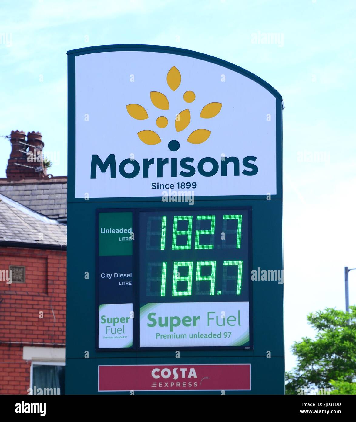 Exterior sign of a Morrisons garage shows fuel prices in Chorlton-cum ...