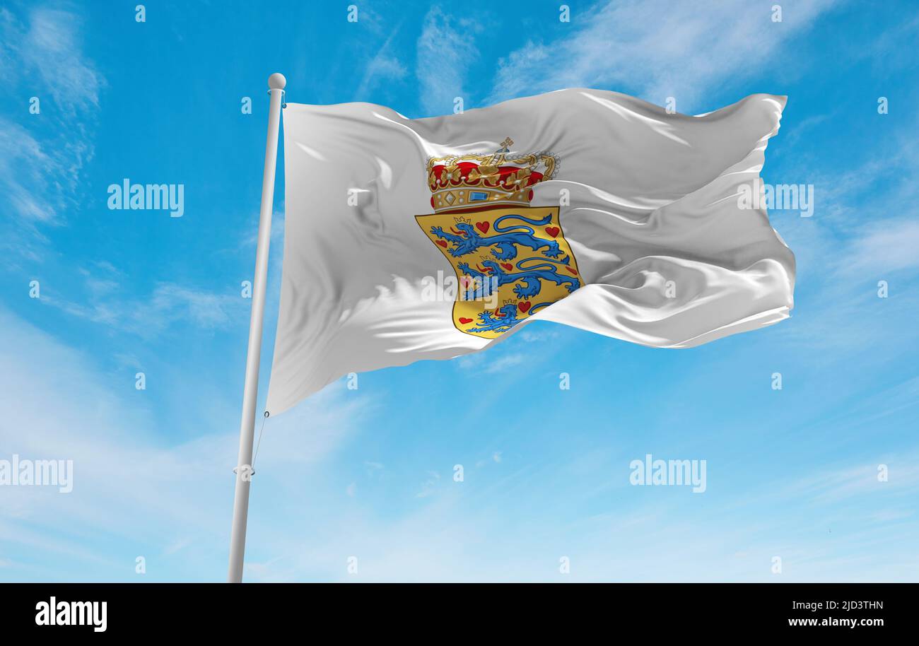 official flag of Naval Ensign of , Denmark at cloudy sky background on ...