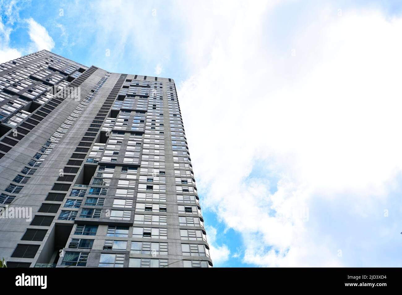 View from the bottom on the high residential building Stock Photo - Alamy