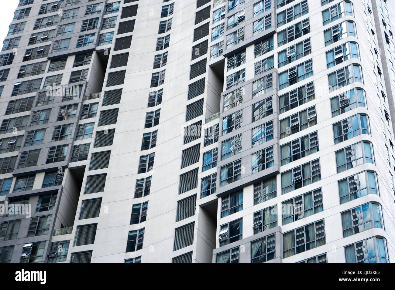 View from the bottom on the high residential building Stock Photo - Alamy