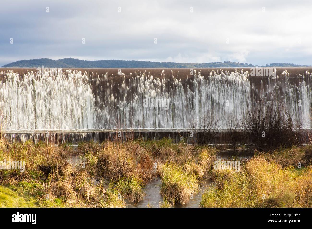 Photograph of water flowing over the spill wall into a creek at Lake ...