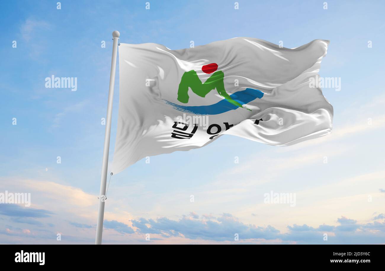 official flag of Miryang city, South Korea at cloudy sky background on ...