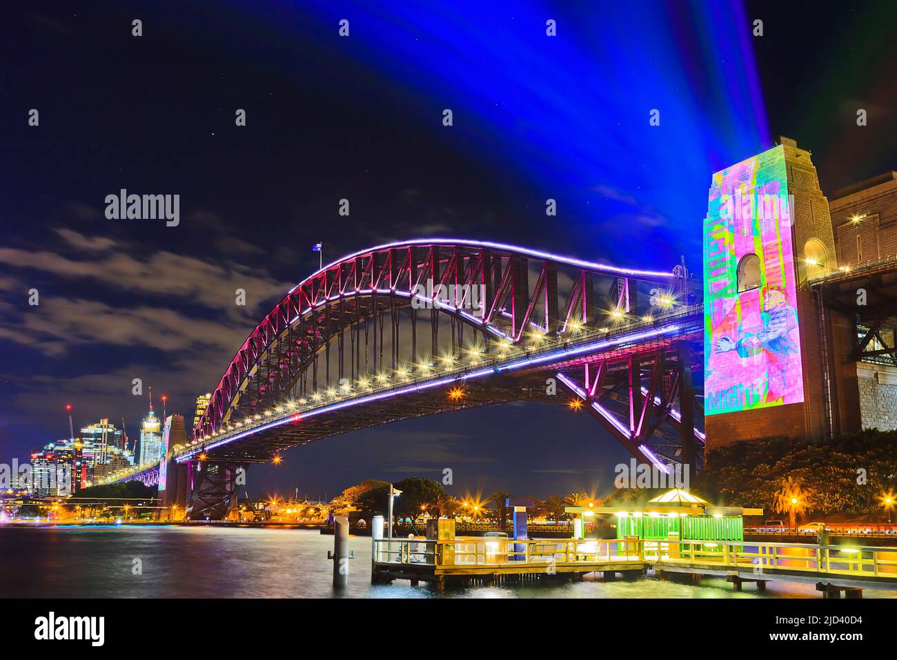 Red light painted arch of the Sydney harbour bridge at Vivid Sydney ...