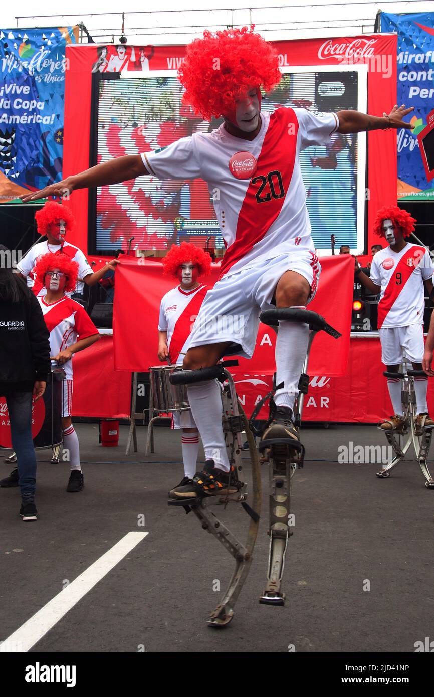 A man jumping on skyrunner when Peruvian fans cheer for their team on ...