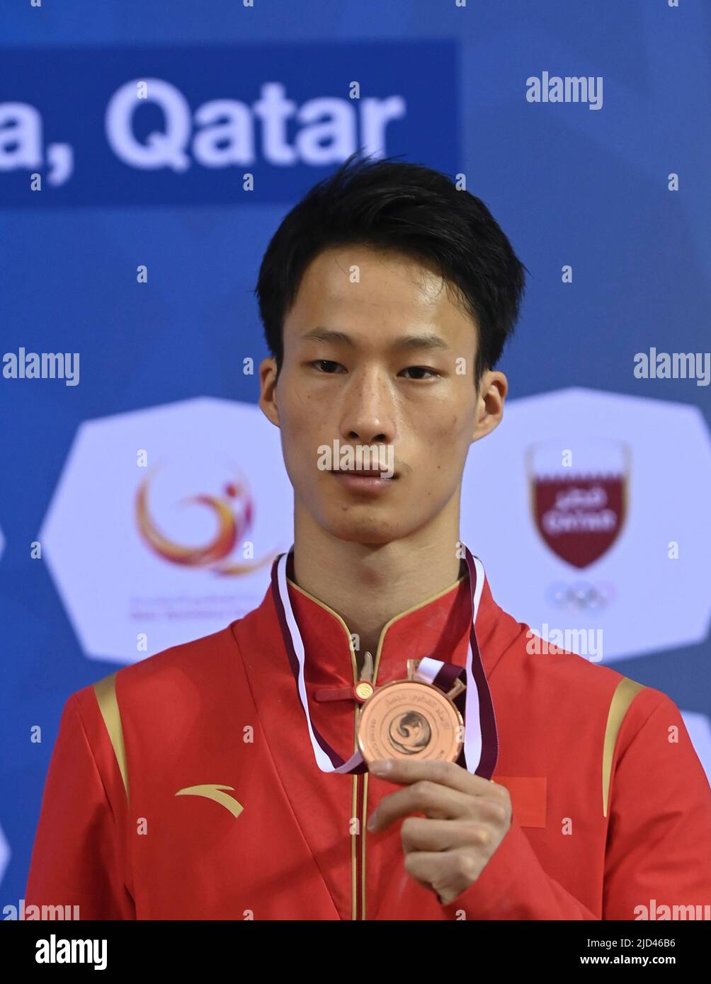 Doha. 17th June, 2022. Yin Dehang of China poses with medal during the ...