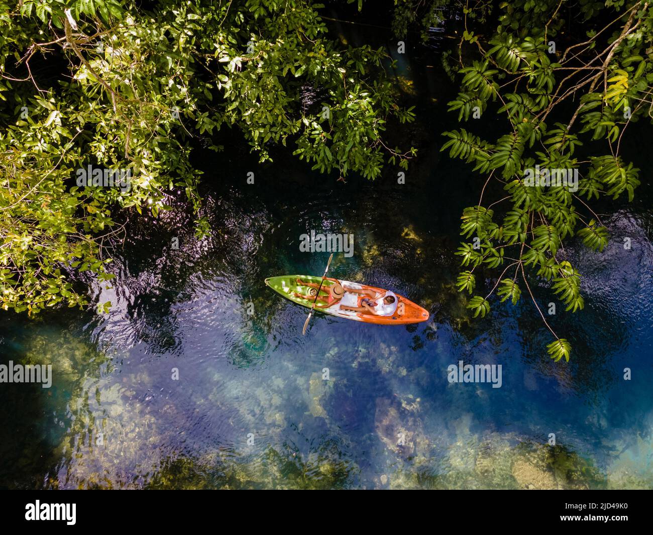 couple in a kayak in the jungle of Krabi Thailand, men and woman in ...