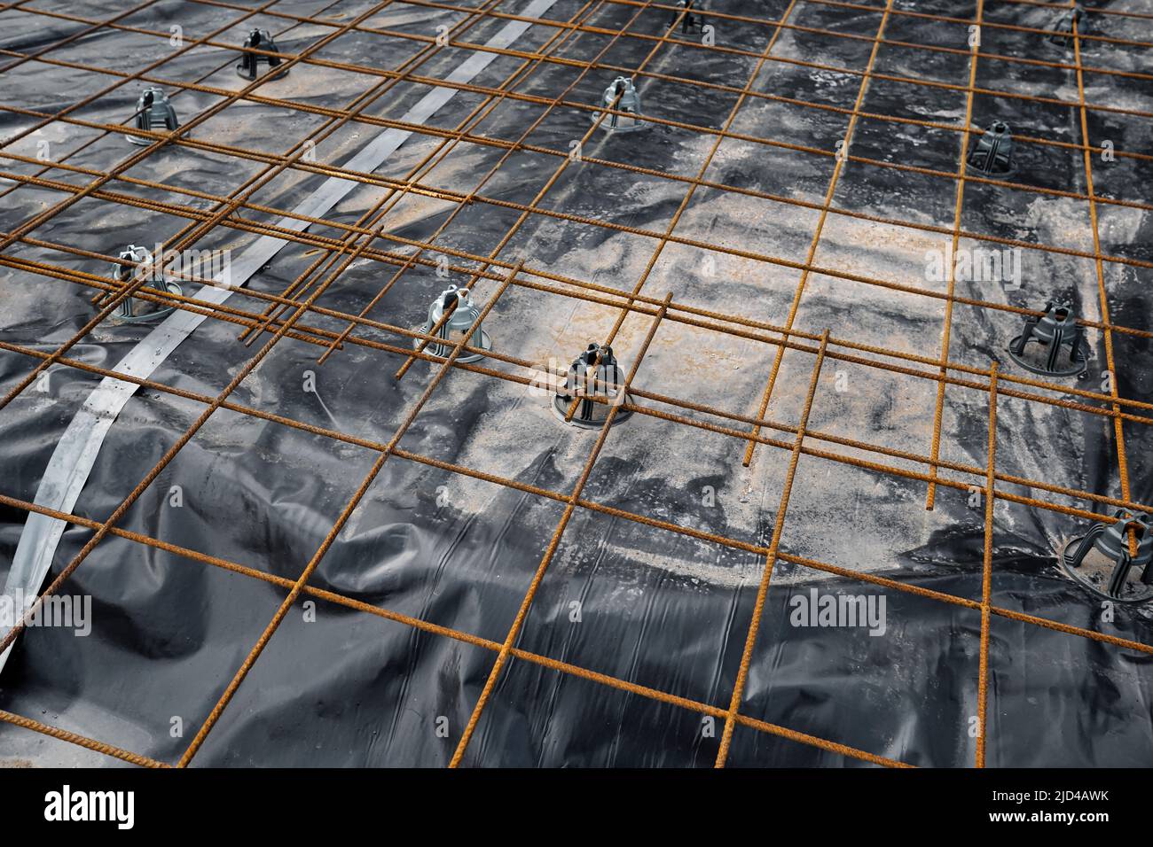 preparing the formwork for the foundation of a new house with steel ...