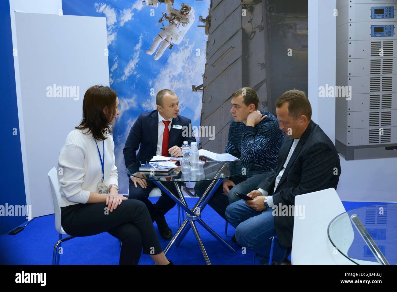 Engaging in dialogue. Managers sitting at the table at the negotiating ...