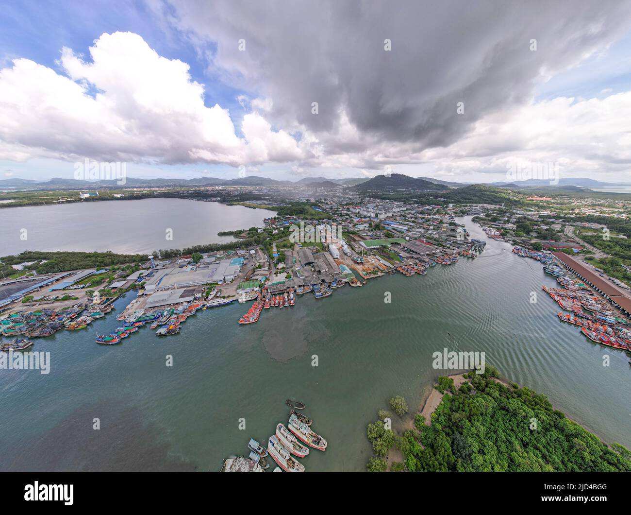 Panorama aerial view of fishing village and large fishing port around ...
