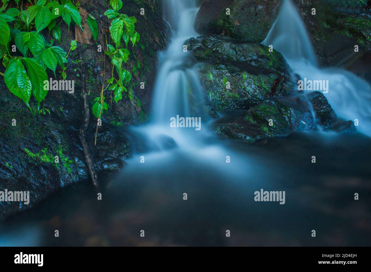 Photo of water flowing between rocks, Aceh, Indonesia Stock Photo - Alamy