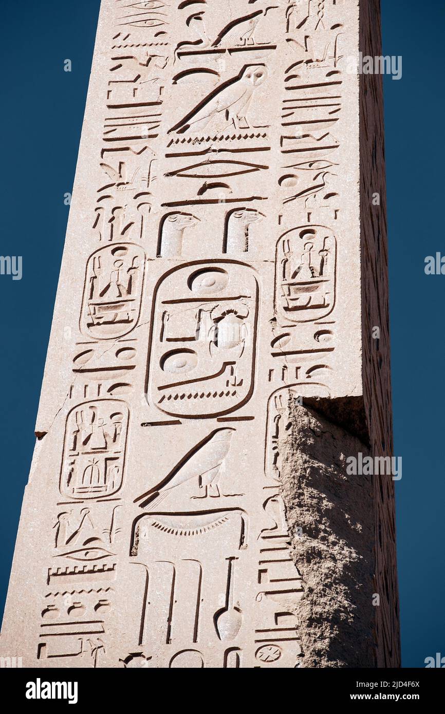 Real ancient Egyptian hieroglyphics engraved in a stone obelisk at Karnak Temple in Luxor Egypt ...