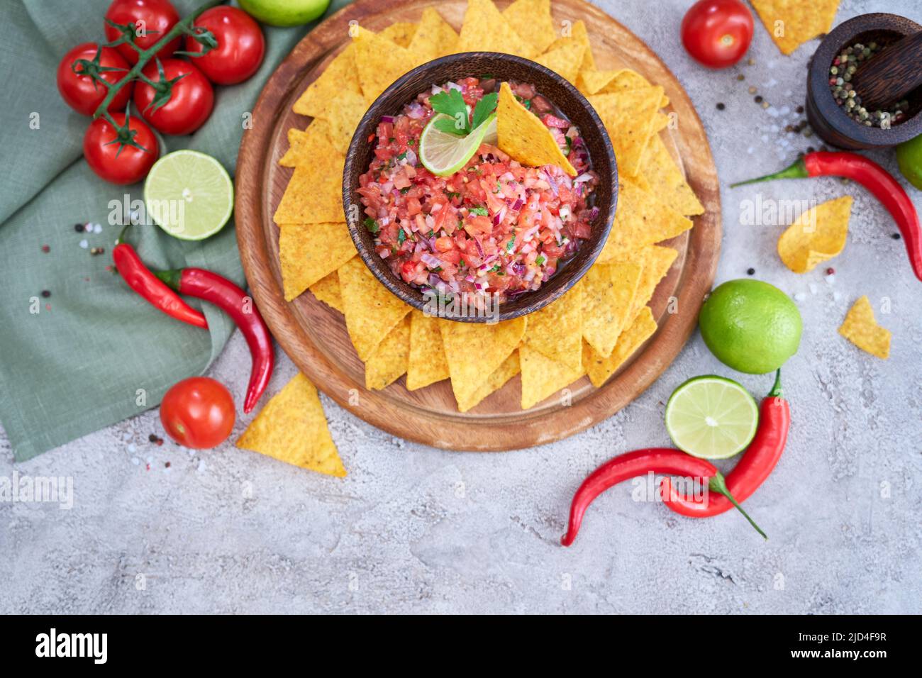 freshly made salsa dip sauce with nacho chips on wooden board Stock ...