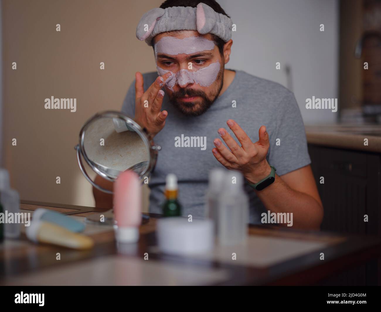 Men's beauty concept. caucAsian guy checking his skin. man looking into ...