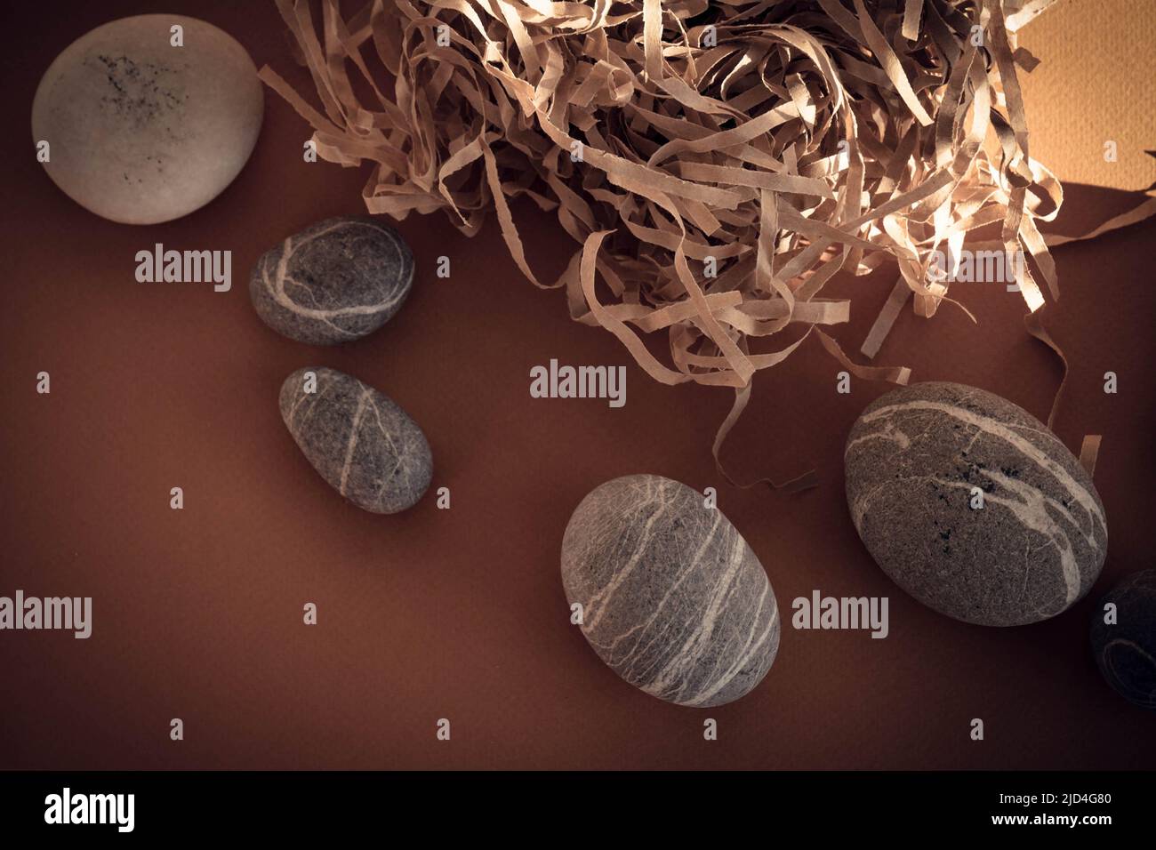 Warm brown background with stones and summer shade lay flat. Background ...