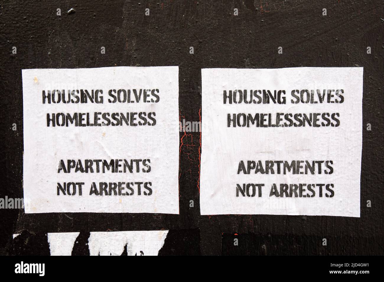 Housing solves homelessness. Apartments not arrests. Hand-cut posters ...