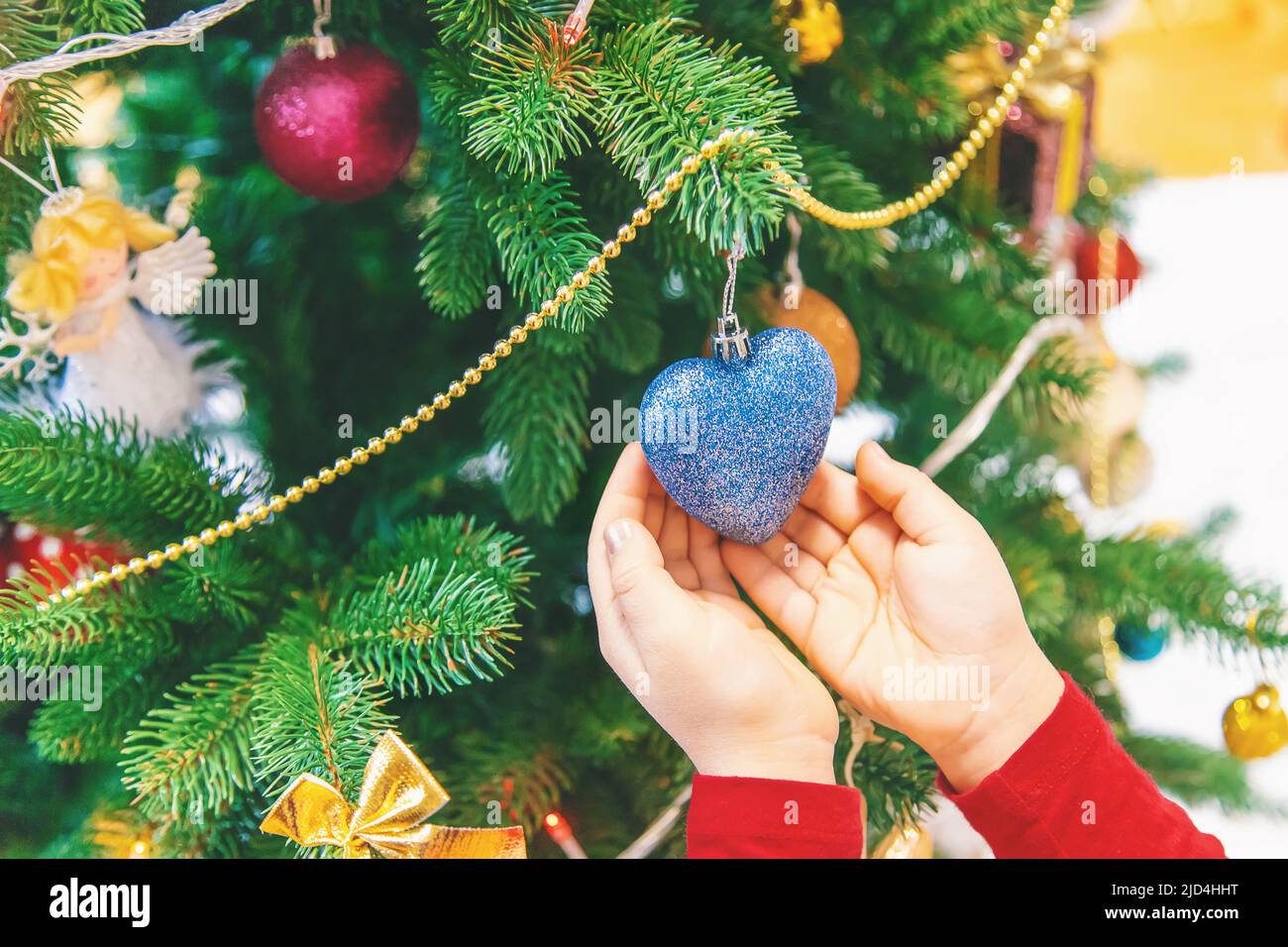 Child happy over christmas background. Christmas tree. Selective focus ...