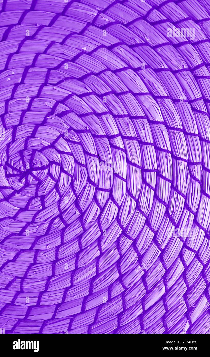 Spiral pattern of vibrant purple colored woven water hyacinth place mat ...
