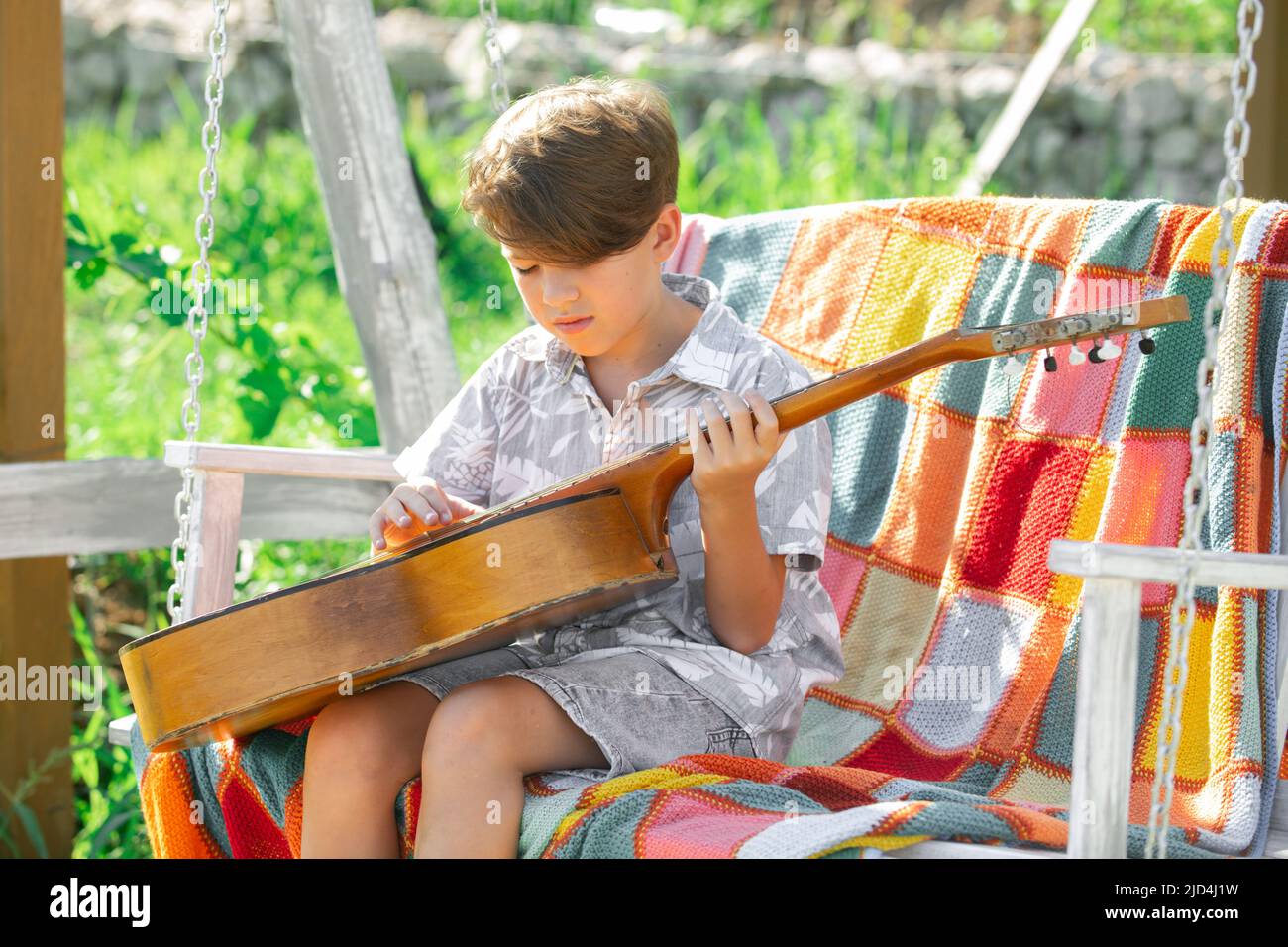 Child with guitar outdoor. Kids music and songs. Dreamy kids face ...