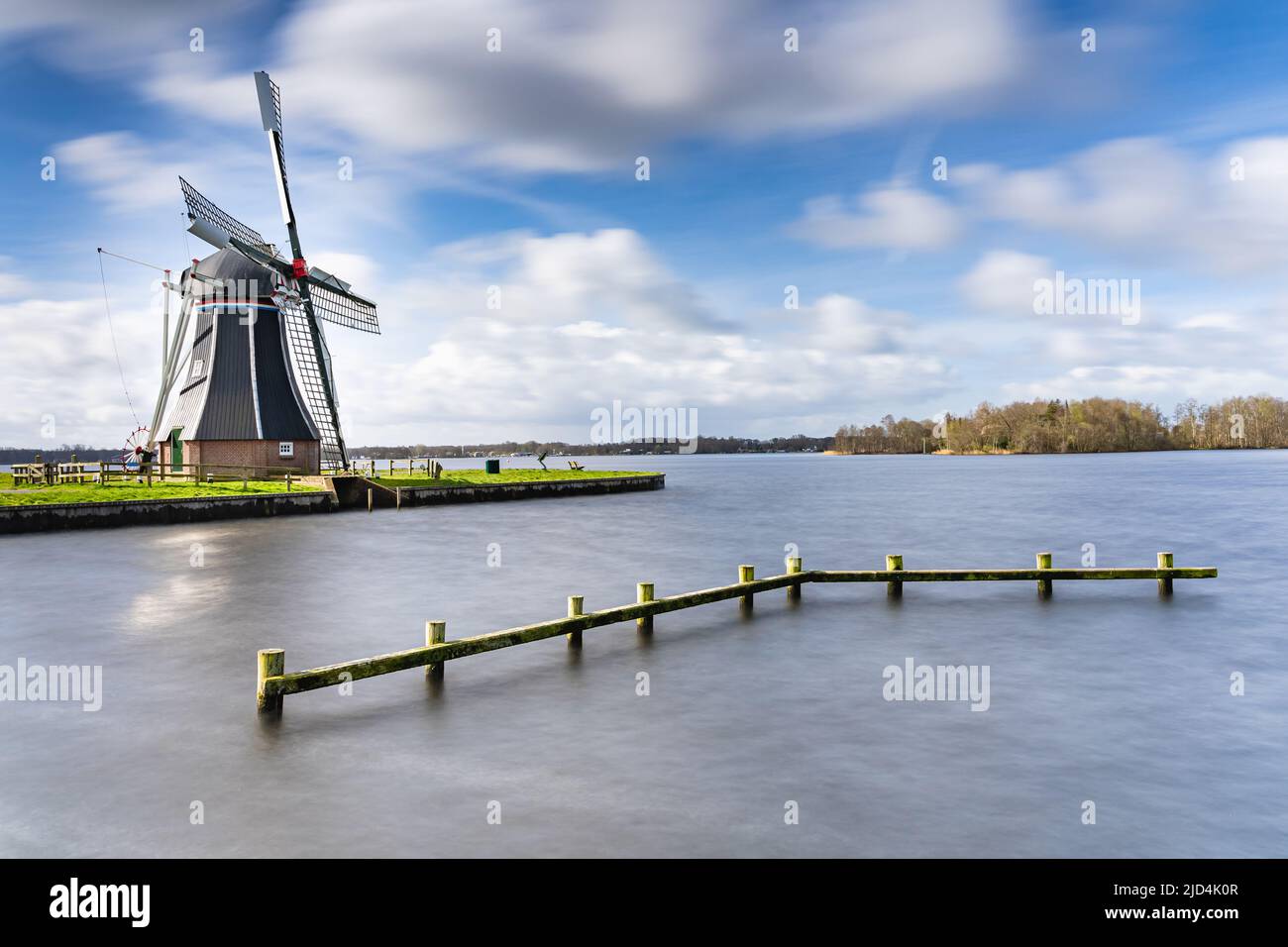 Waterways of Holland and view on traditional Dutch wind mill, Dutch ...