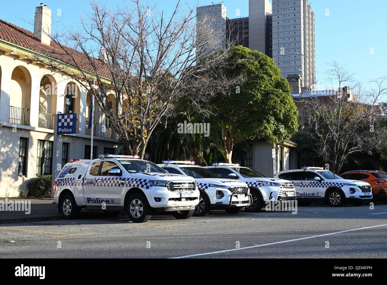 Police vehicles, a Ford Ranger, two Hyundai Santa Fe, and a Toyota ...