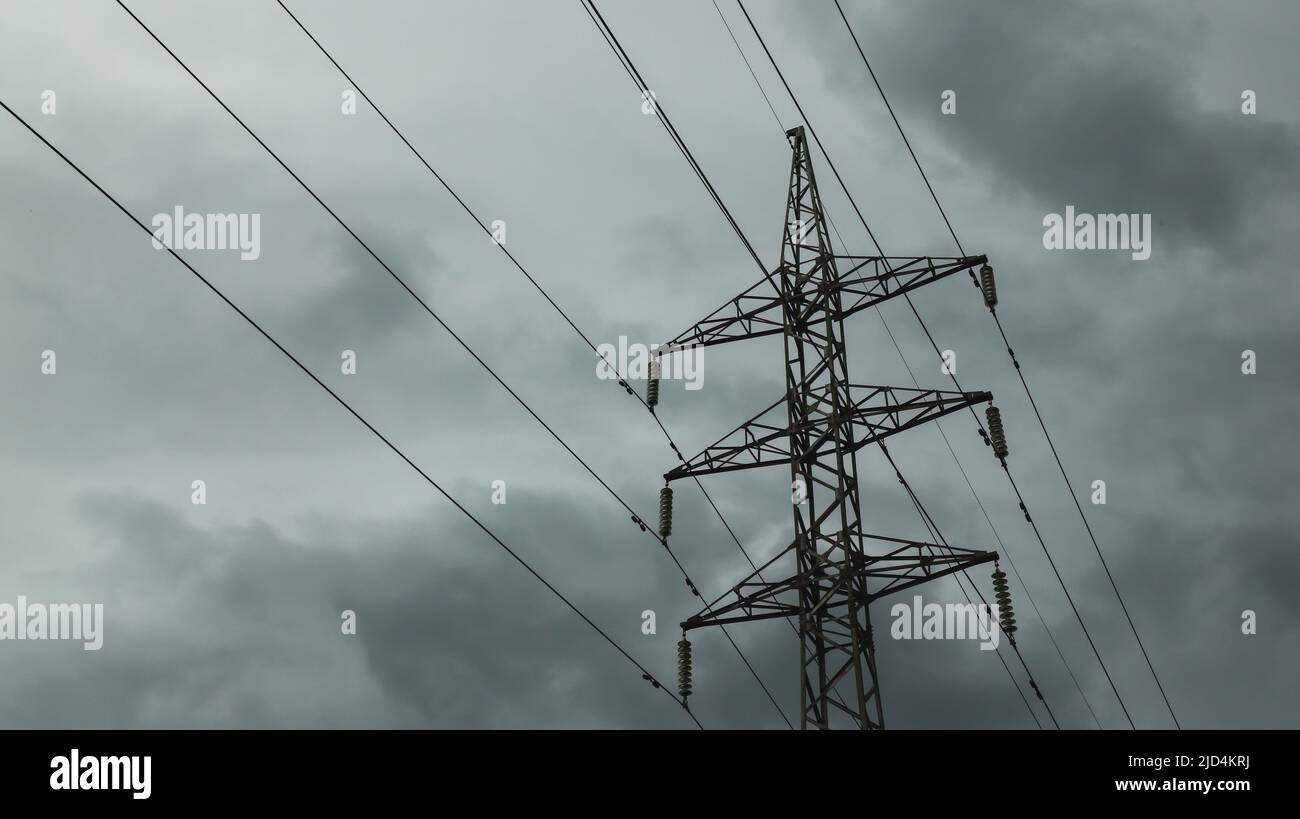 Power line pylon against the background of the dark cloudy sky Stock ...